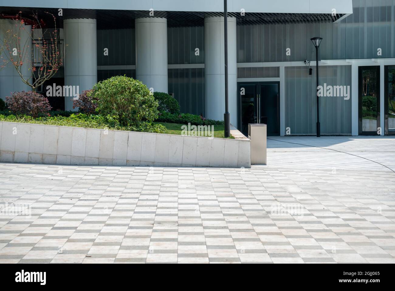Concrete ground floor in front of a modern building Stock Photo - Alamy