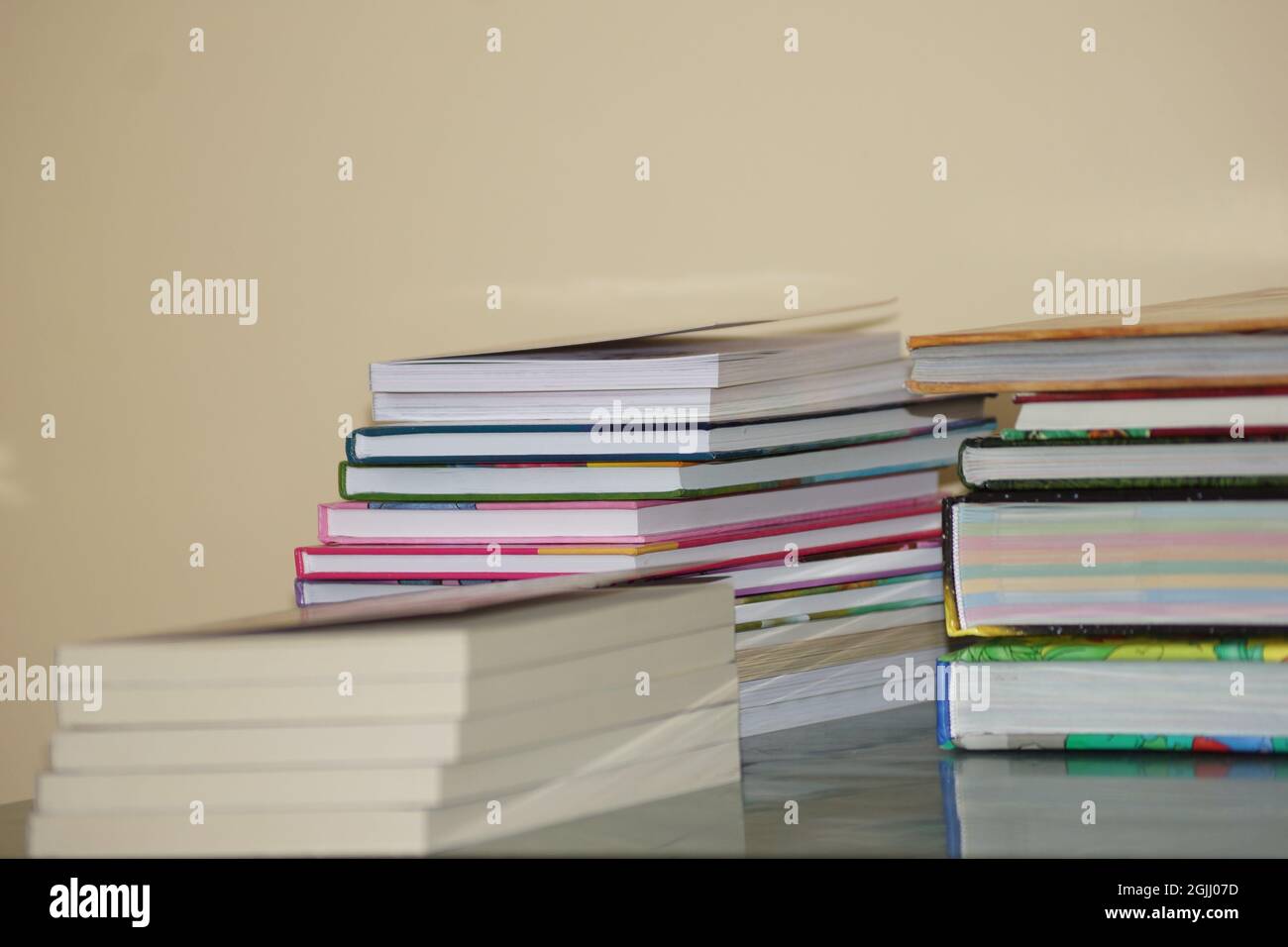A stack of books with colorful covers Stock Photo - Alamy