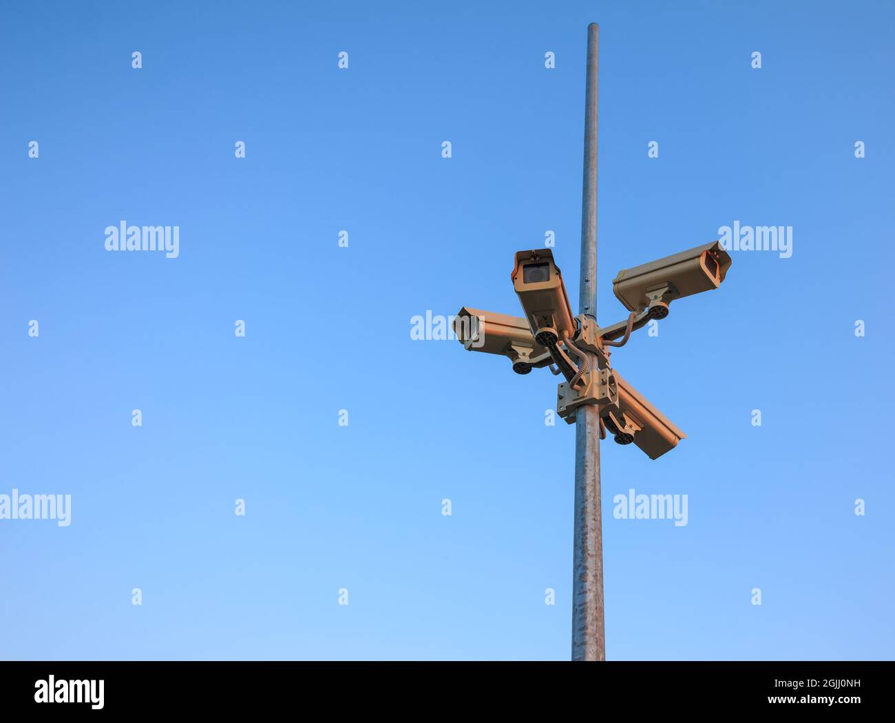 Column surveillance cameras on clear blue background, copy space Stock ...