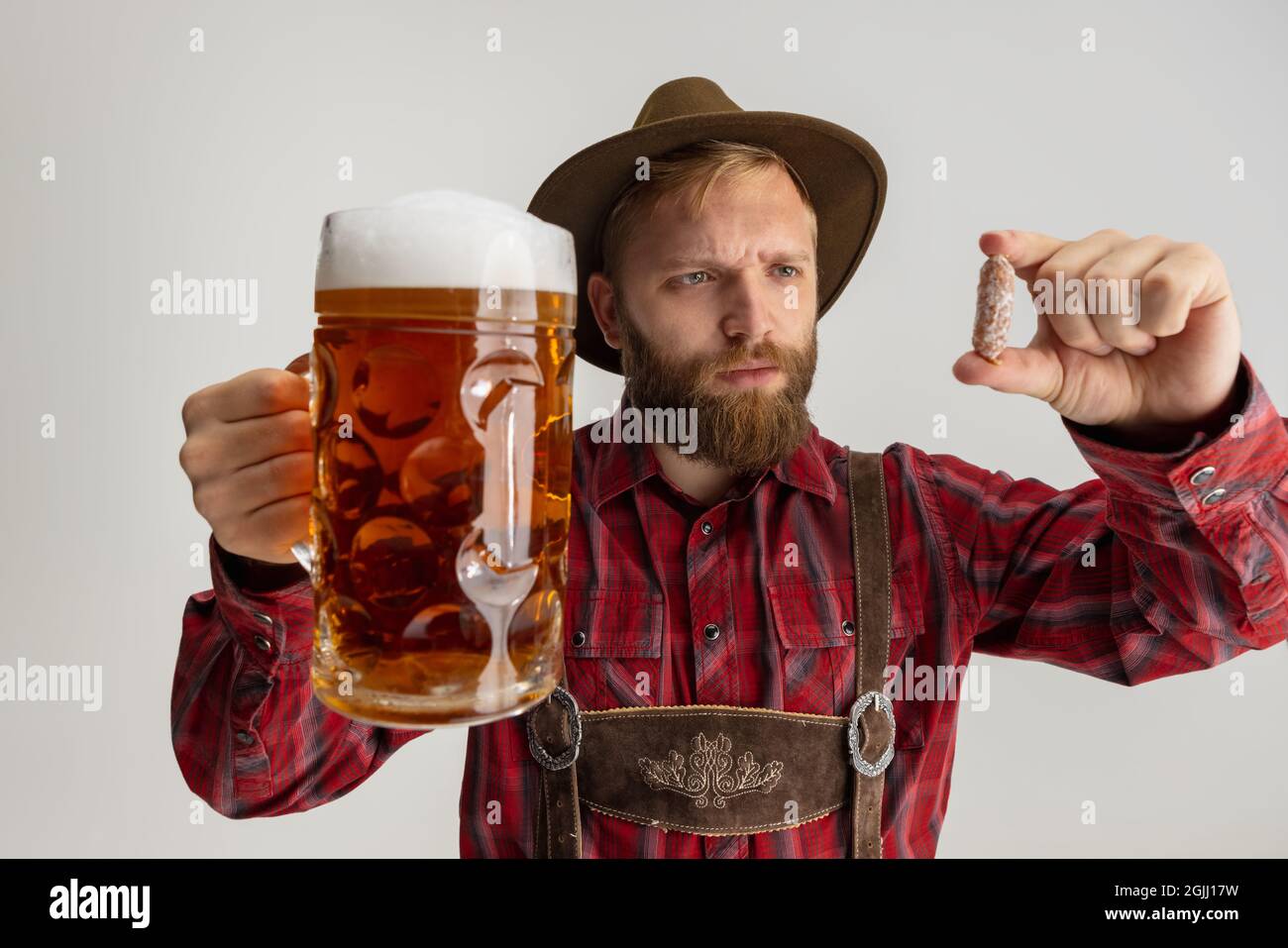 Comic portrait of bearded man in hat and traditional Bavarian costume ...