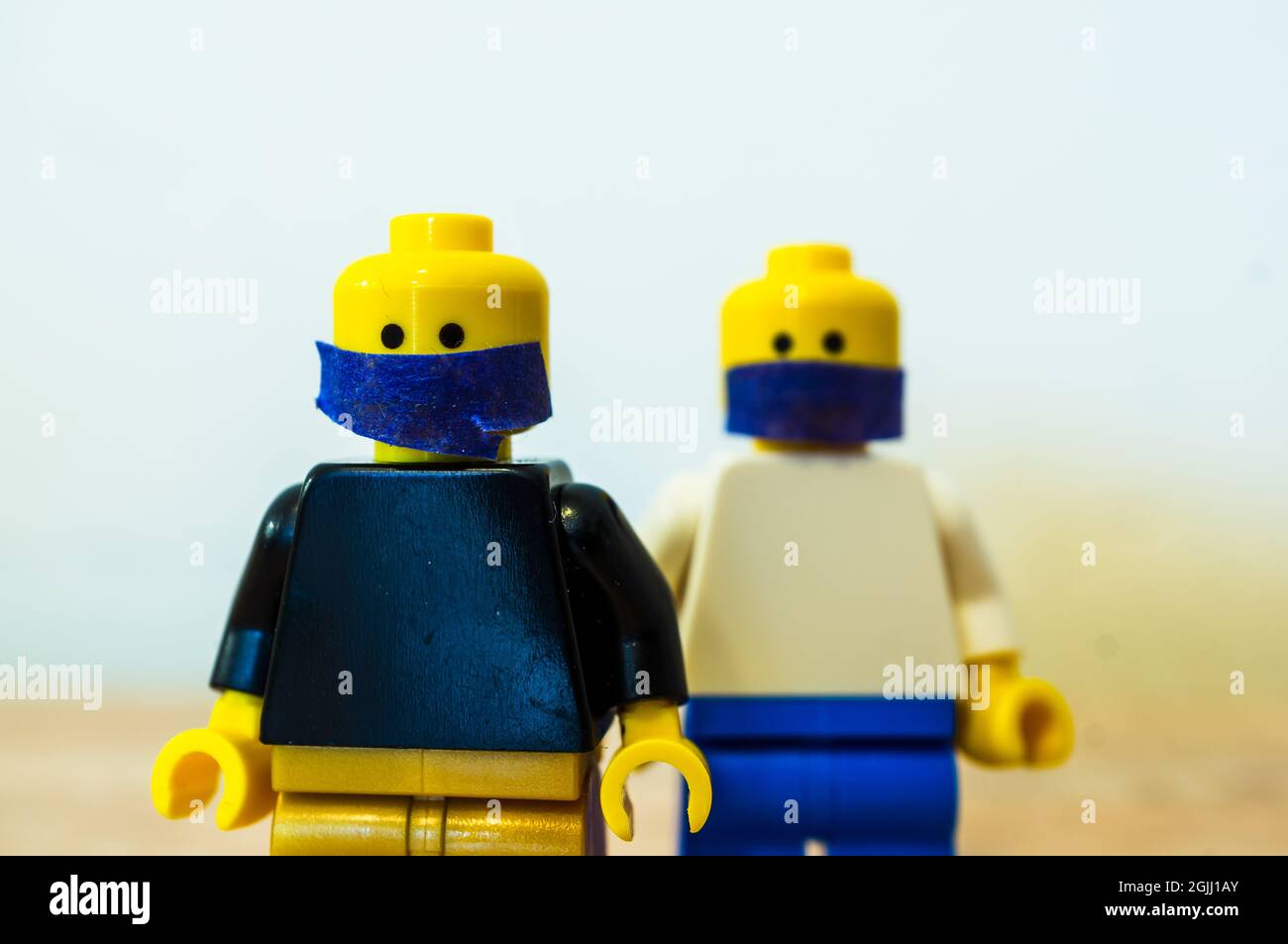 POZNAN, POLAND - May 15, 2020: Two Lego figurines wearing face masks ...