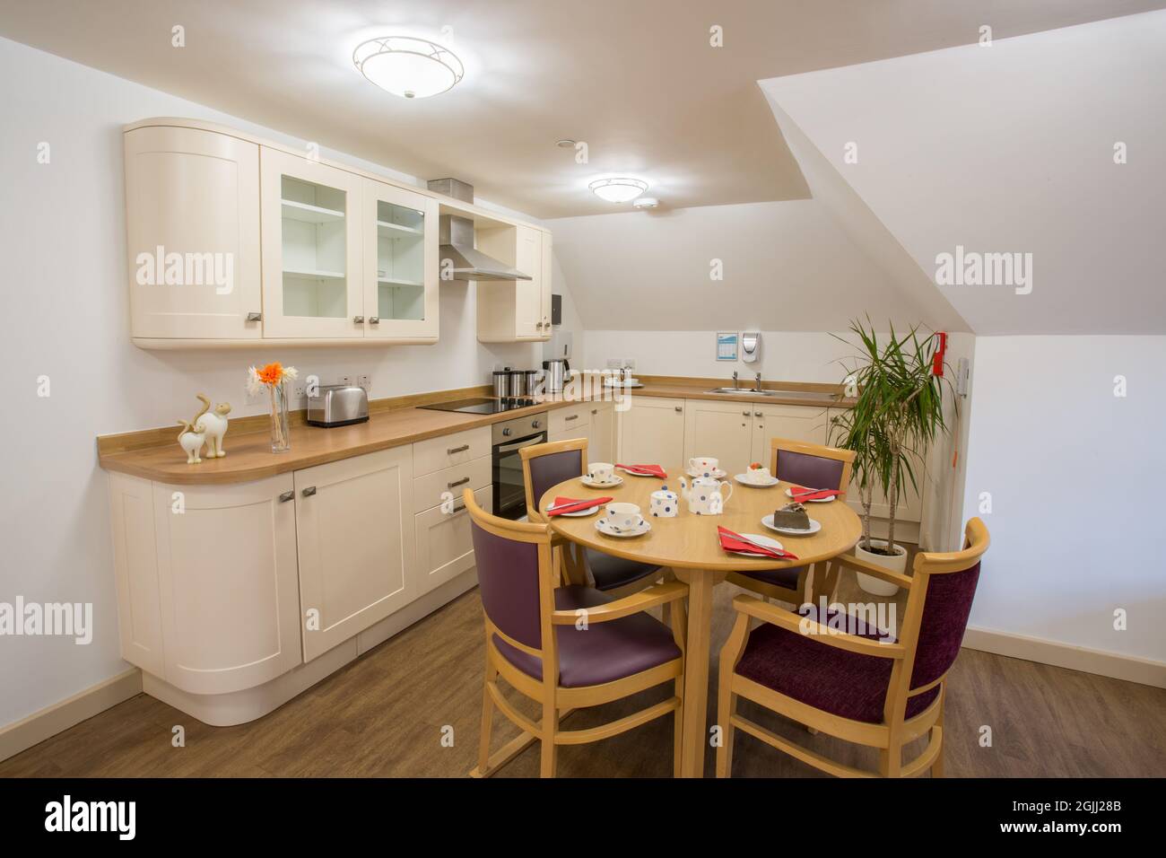 Cozy kitchen interior in beige tones with kitchenware, shelves, round ...