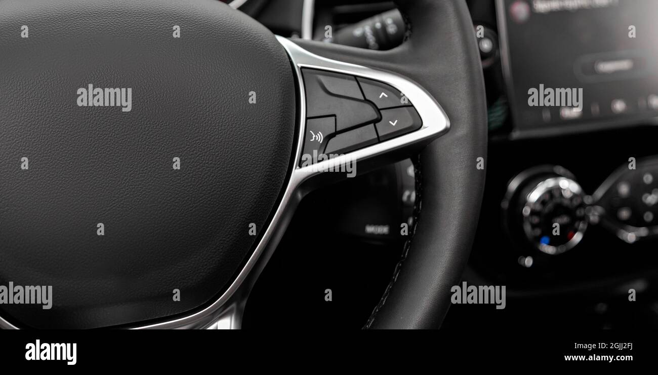 black steering wheel with multifunction buttons for quick control ...
