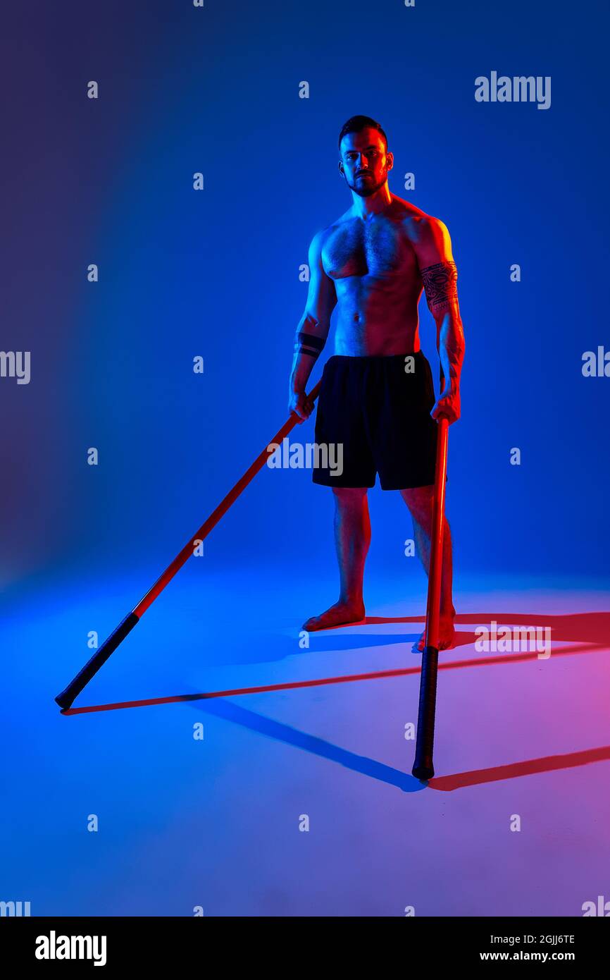 athlete men silhouette with stick training karate using sports tool in ...
