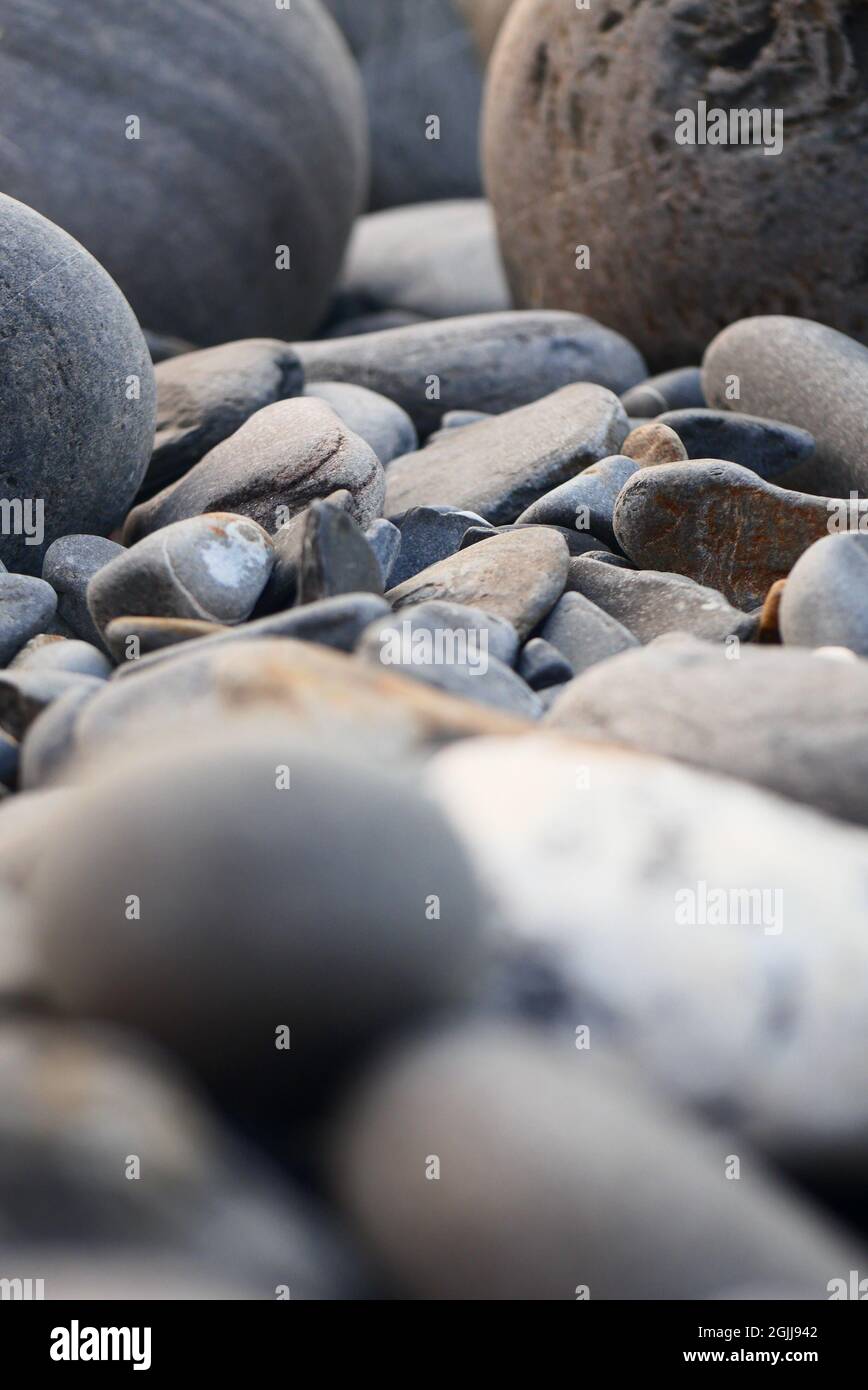 Vertical shot of pebble stones of different shapes and sizes Stock ...