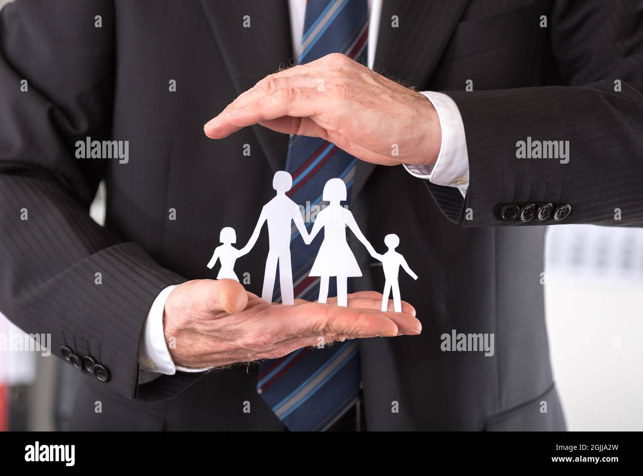Concept of family insurance with hands protecting a family Stock Photo ...