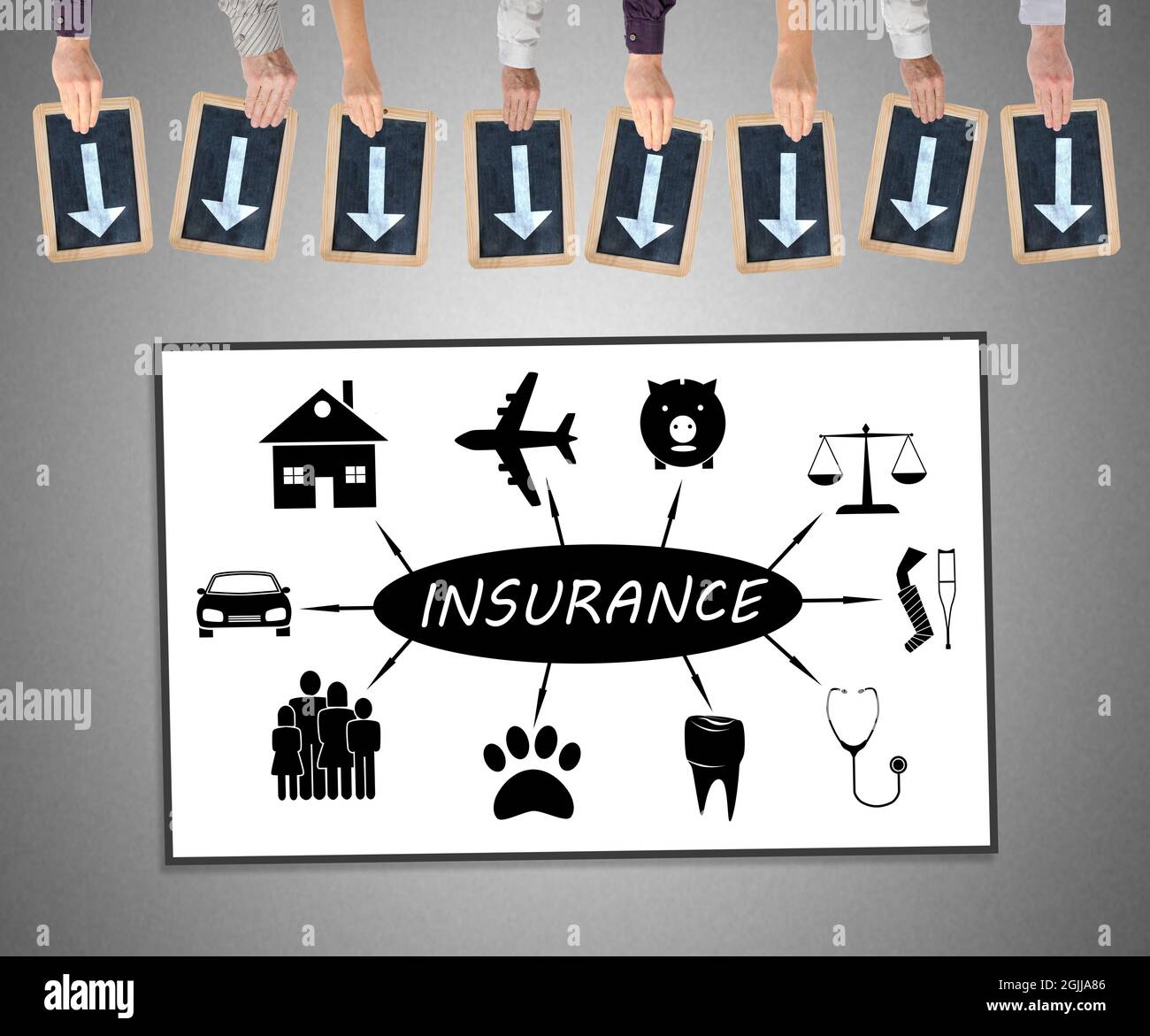 Hands holding writing slates with arrows pointing on insurance concept ...