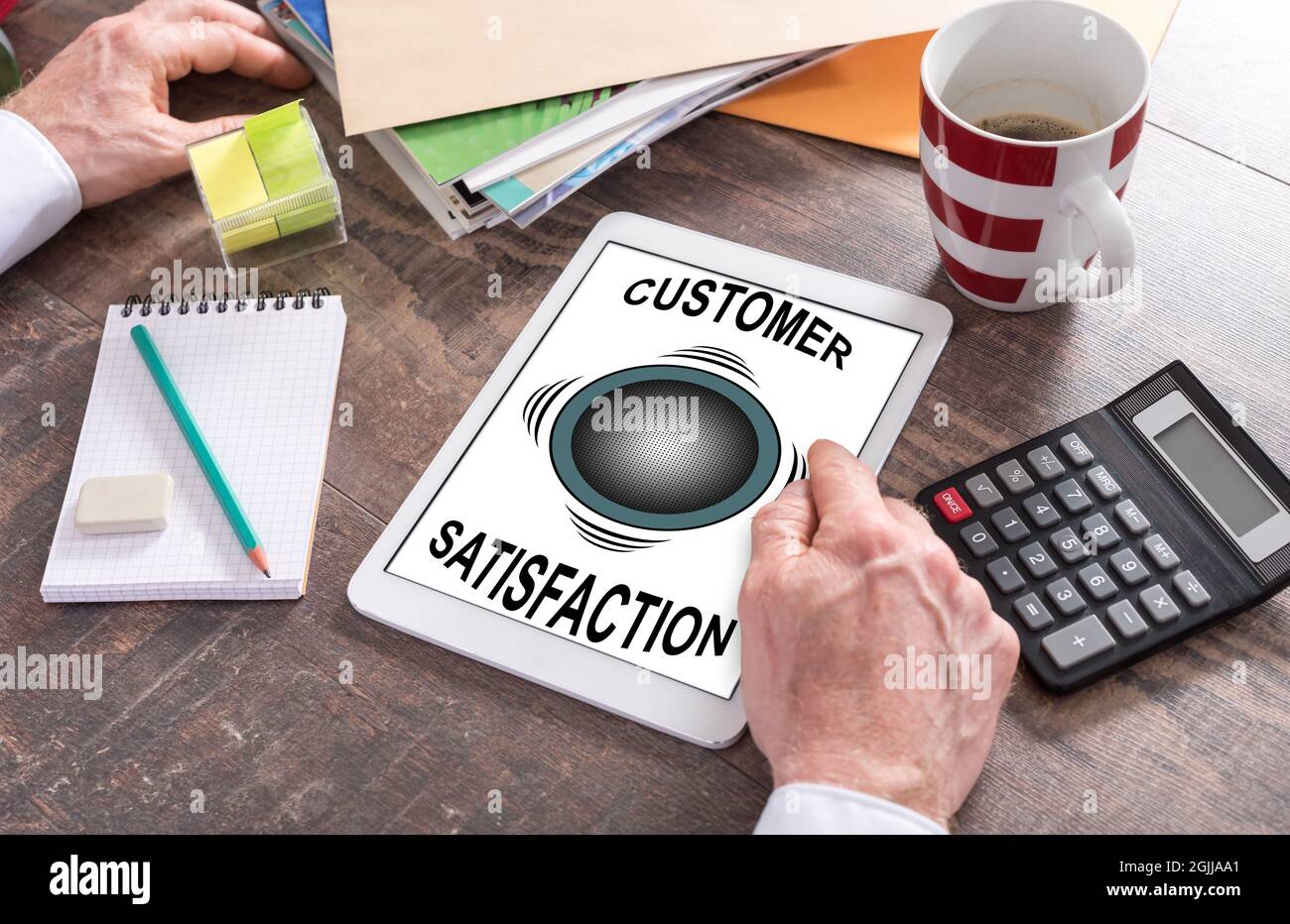Man using a tablet showing a customer satisfaction concept Stock Photo ...