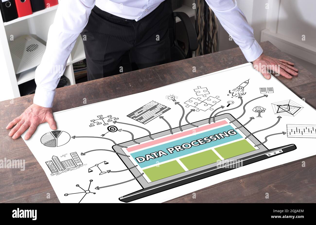 Man watching a data processing concept placed on a desk Stock Photo - Alamy