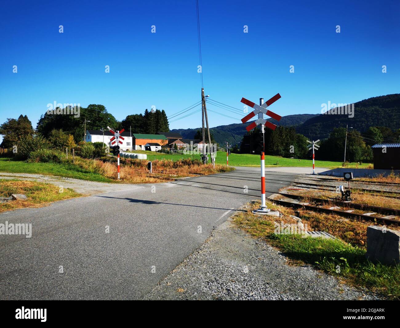 Road signs in the railway crossing in daylight Stock Photo - Alamy