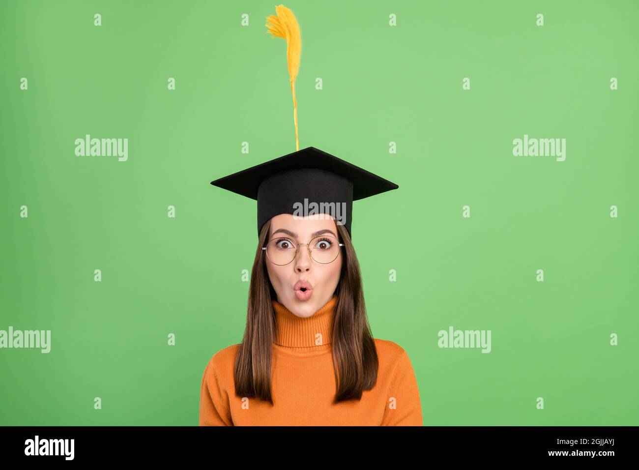 Portrait of attractive amazed comic childish girl master degree having ...