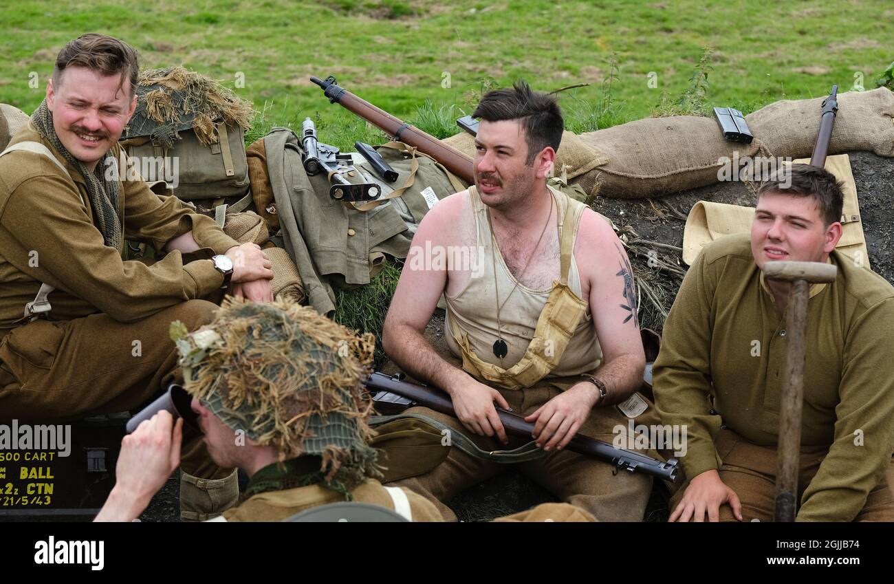 Enactors dressed in second world war British uniform staging battle and ...