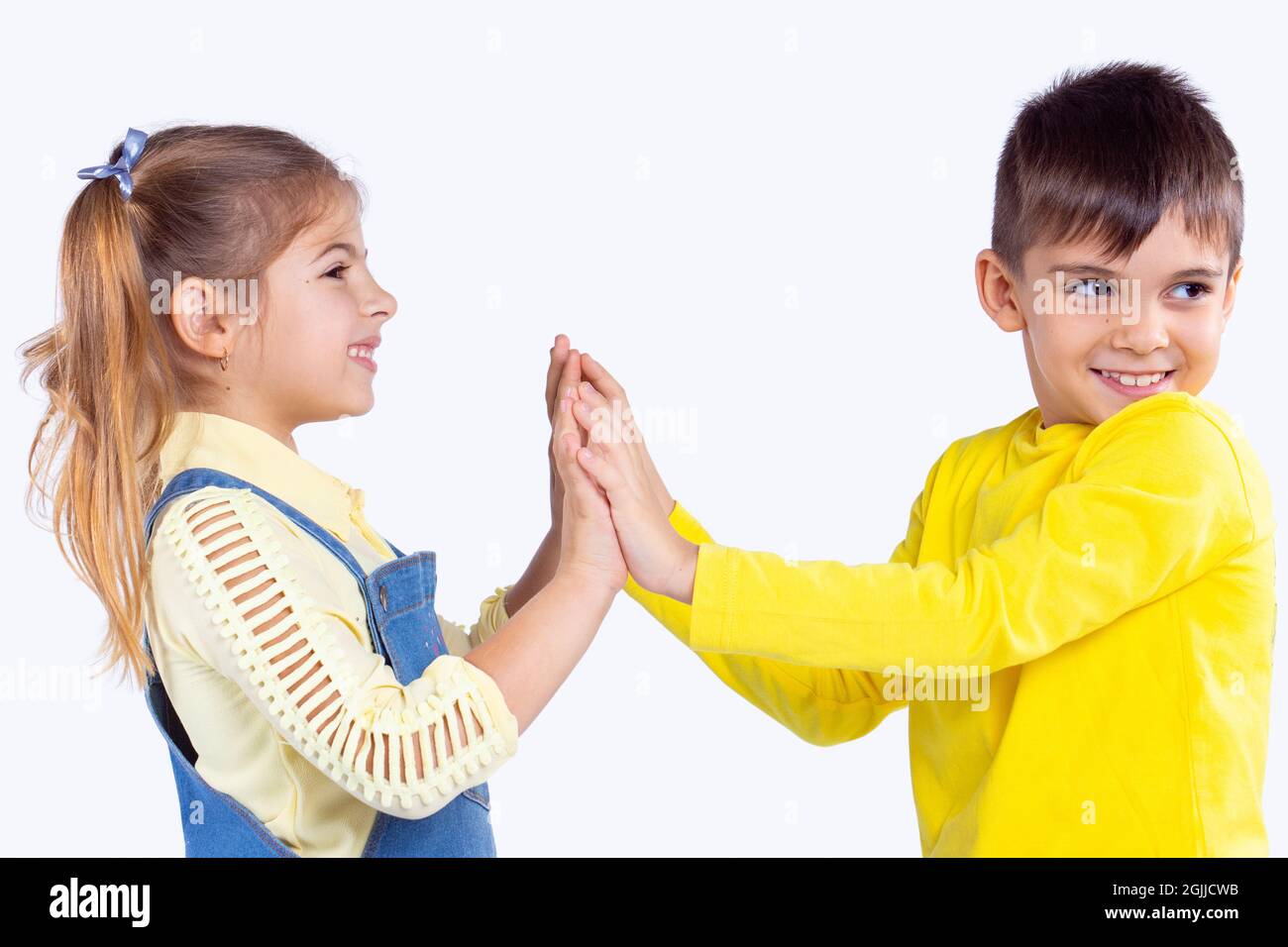 Holding hands children shy hi-res stock photography and images - Alamy