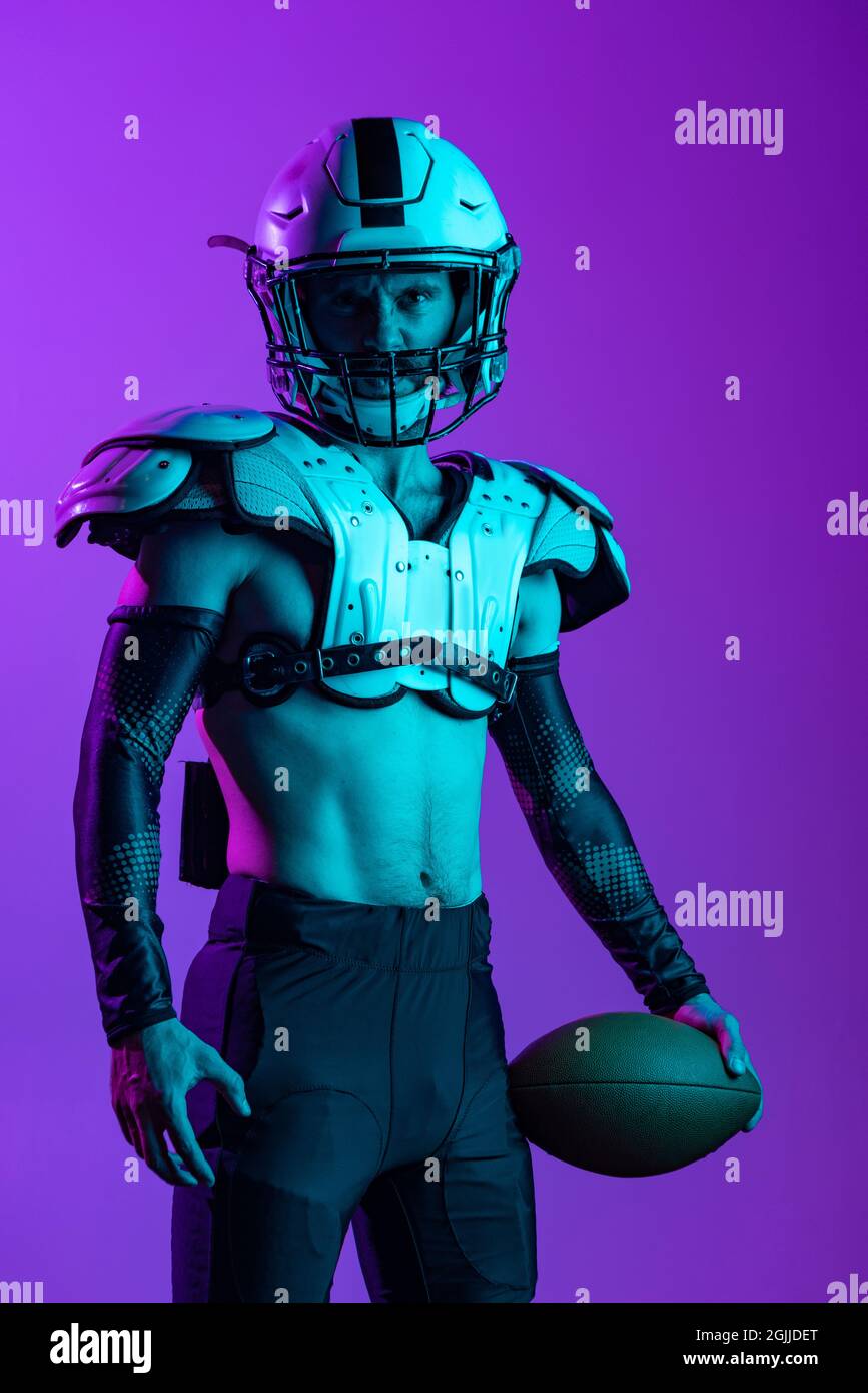 Portrait of one professional american football player wearing helmet ...