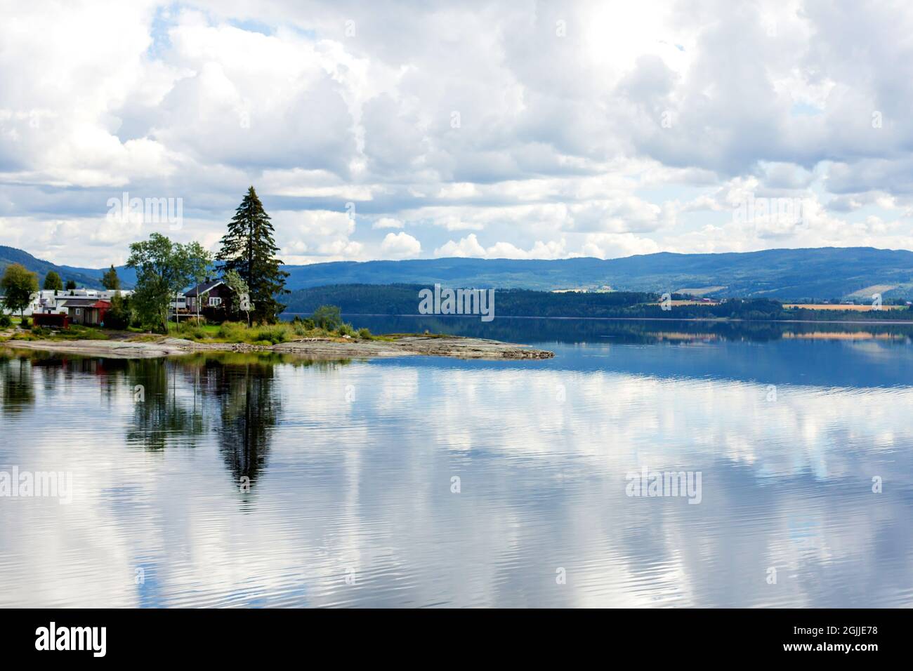Beautiful landscape in Norway with fjords, trees and beautiful sky ...