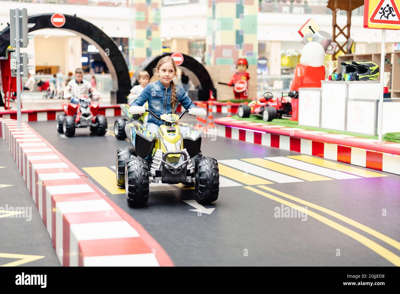 Moscow, Russia, 28 May 2021 - little happy kid girl fun riding an small ...