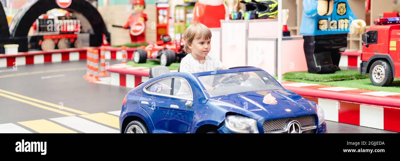 Moscow, Russia, 28 May 2021 - little happy kid boy fun riding an small ...