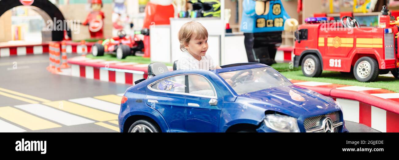 Moscow, Russia, 28 May 2021 - little happy kid boy fun riding an small ...