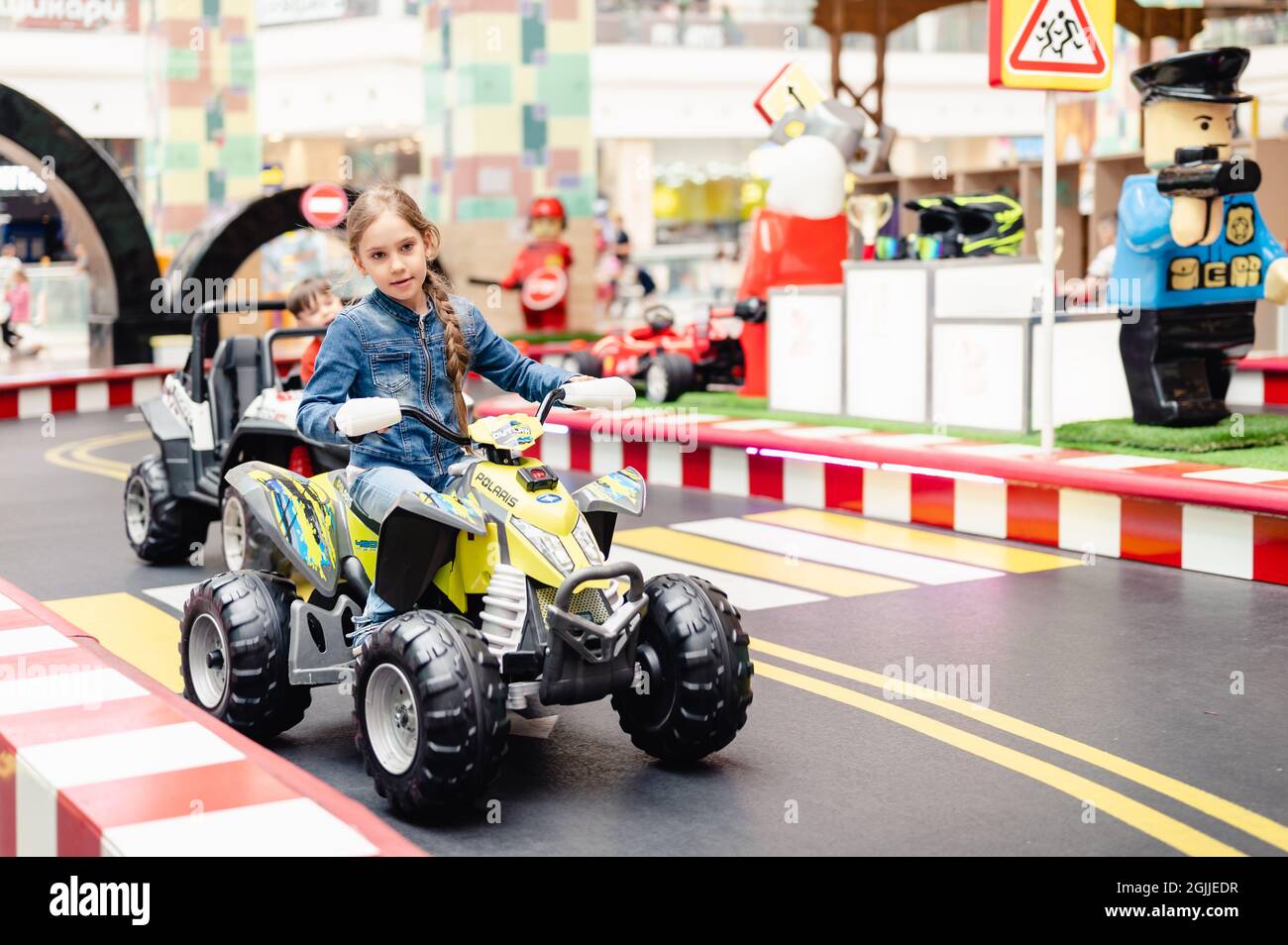 Moscow, Russia, 28 May 2021 - little happy kid girl fun riding an small ...