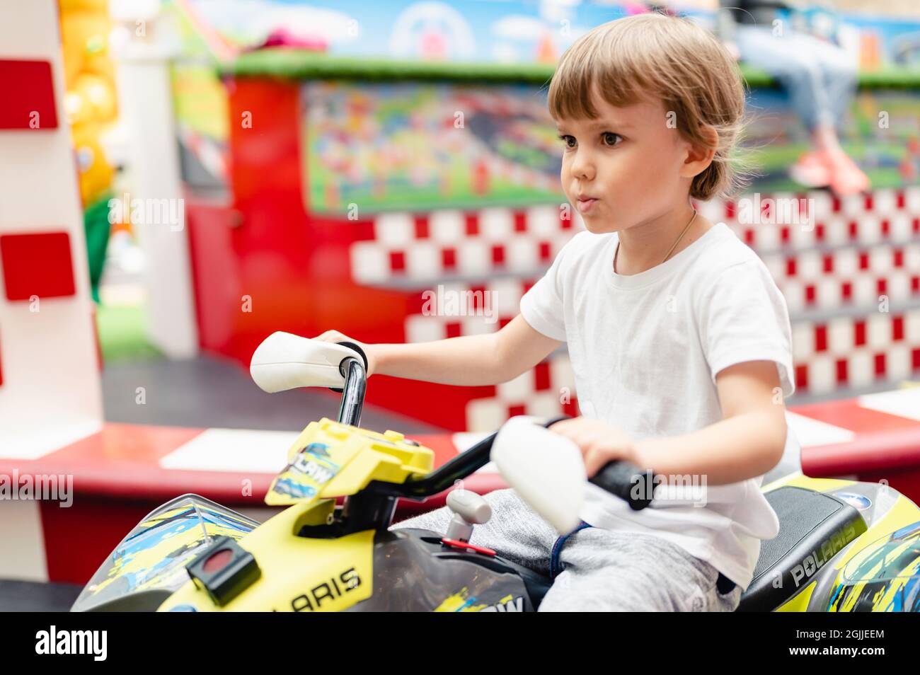 Moscow, Russia, 28 May 2021 - little happy kid boy fun riding an small ...