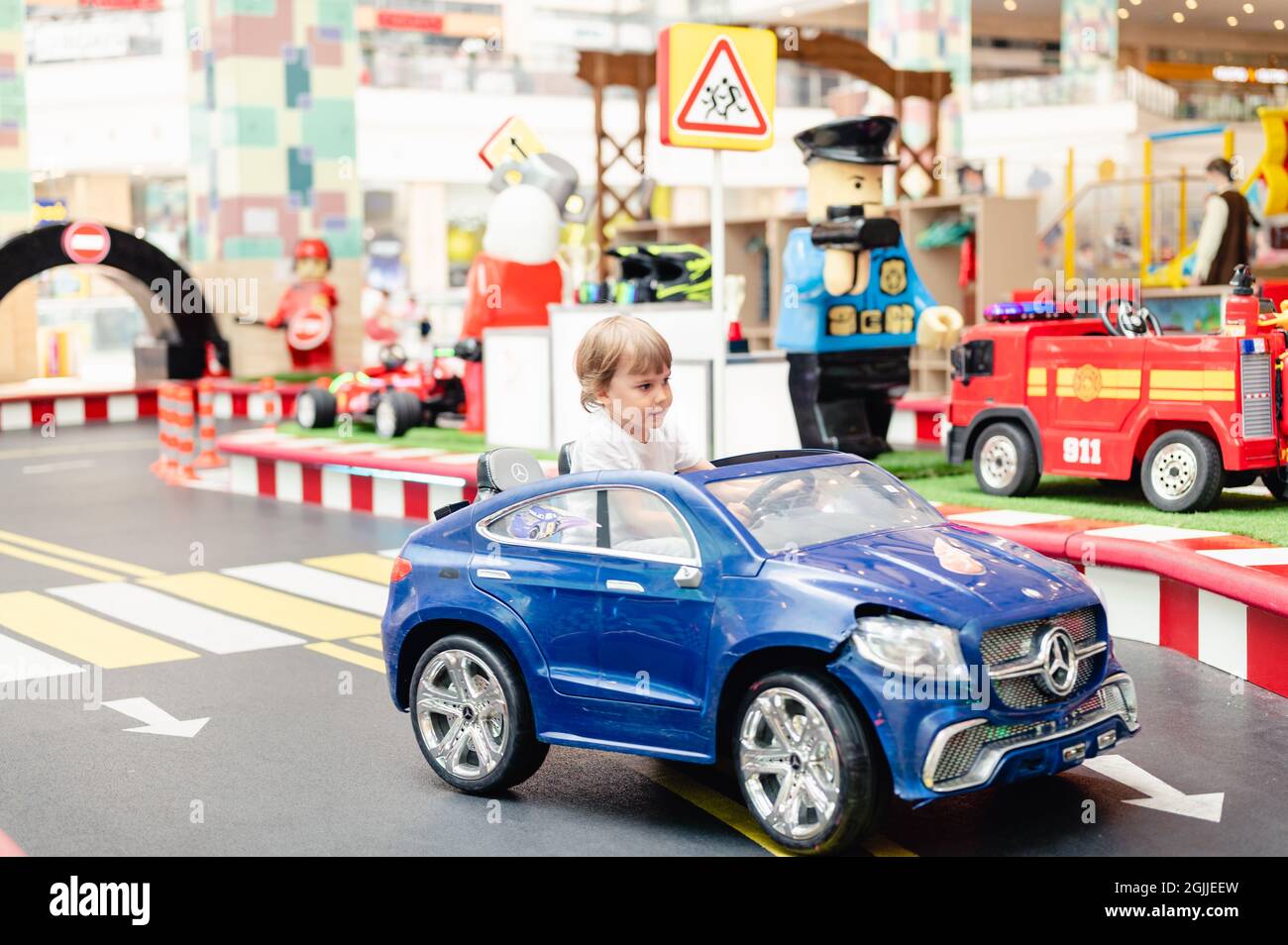 Moscow, Russia, 28 May 2021 - little happy kid boy fun riding an small ...