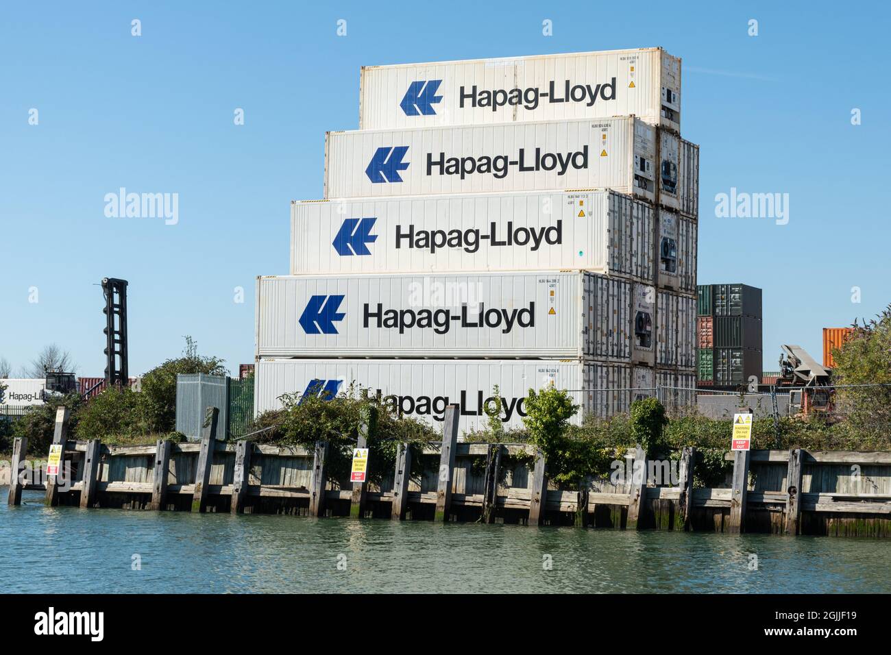 Hapag-Lloyd shipping containers stacked up at Eling Wharf on Southampton Water, Hampshire ...