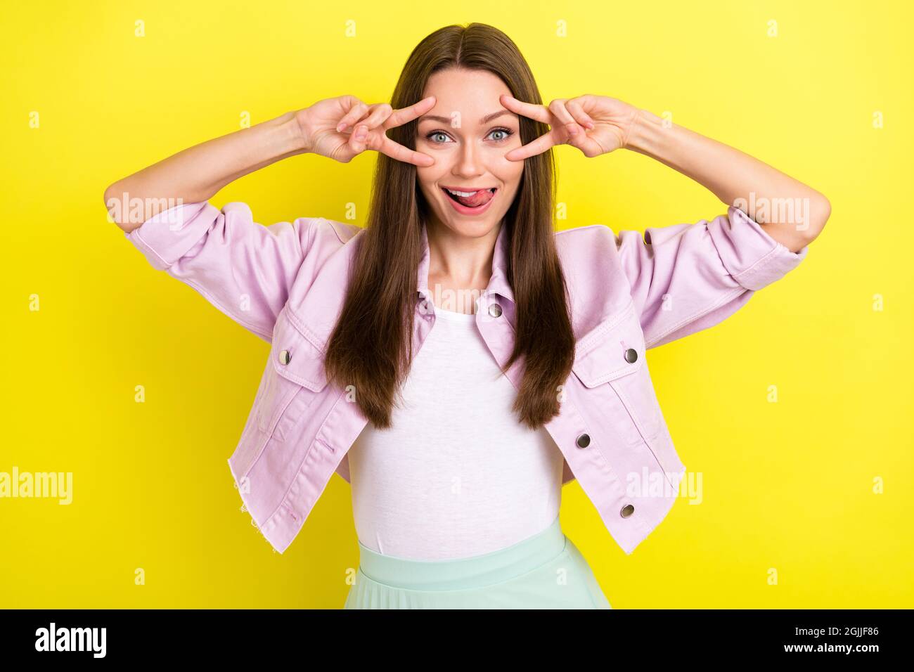 Photo portrait smiling girl showing v-sign gesture licking lips ...