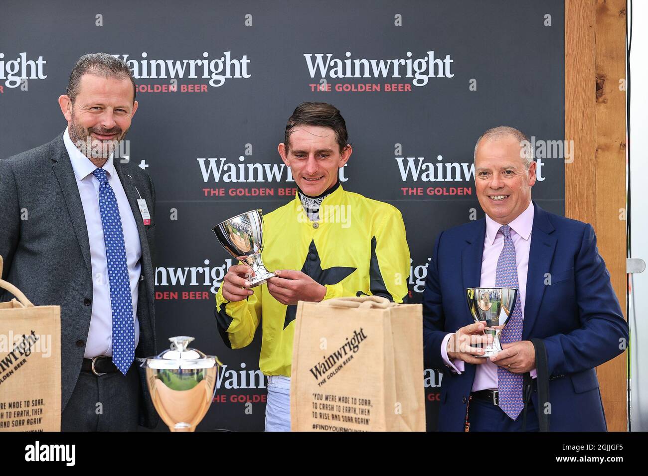 Jockey Adam Kirby with trainer Clive Cox after winning the Wainwright ...