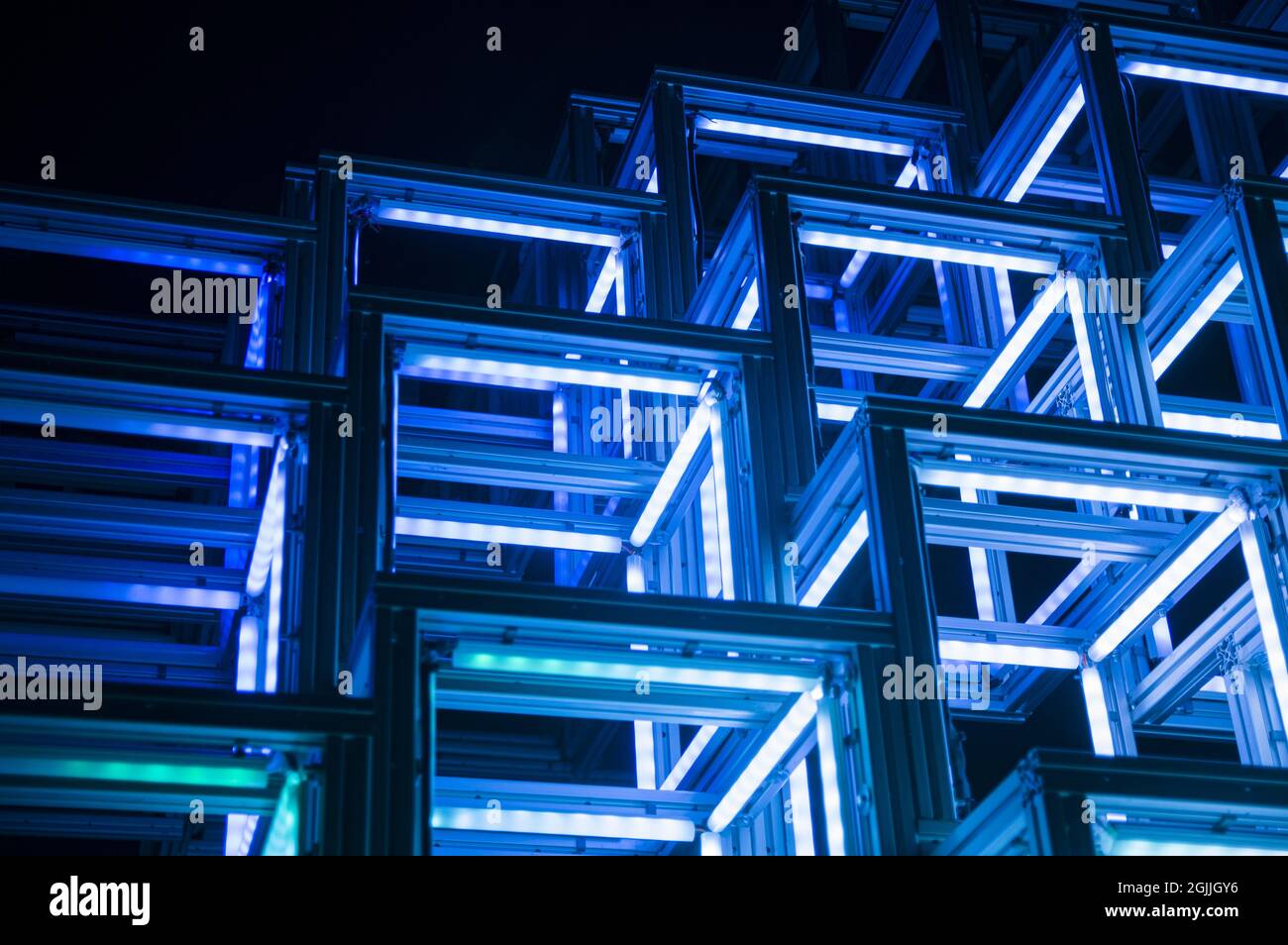Abstract conceptual background with neon blue cubes in the dark, modern ...