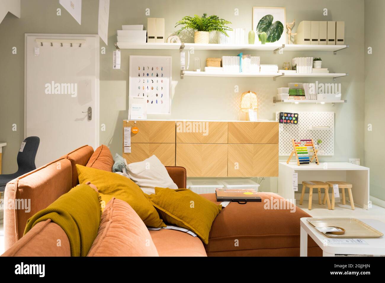 Sitting room with wall storage units and shelvings, coffee table and ...