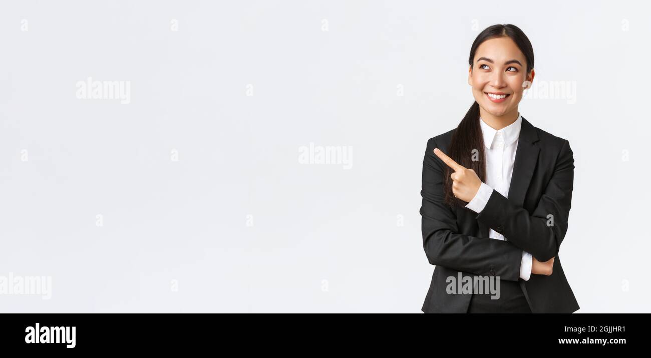 Successful upbeat smiling asian female manager, businesswoman in suit ...