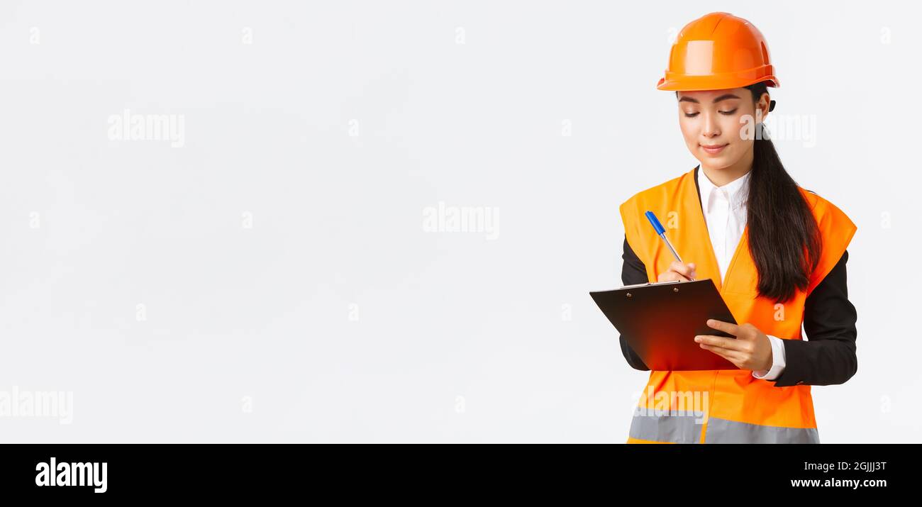 Female construction engineer taking notes hi-res stock photography and ...
