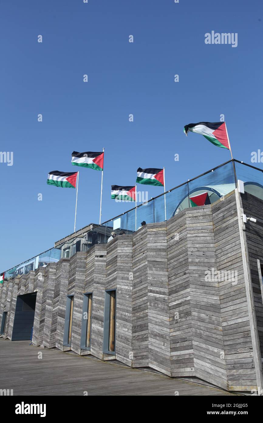 Palestinian flags flying on Hastings pier during 'Palestine on the Pier ...
