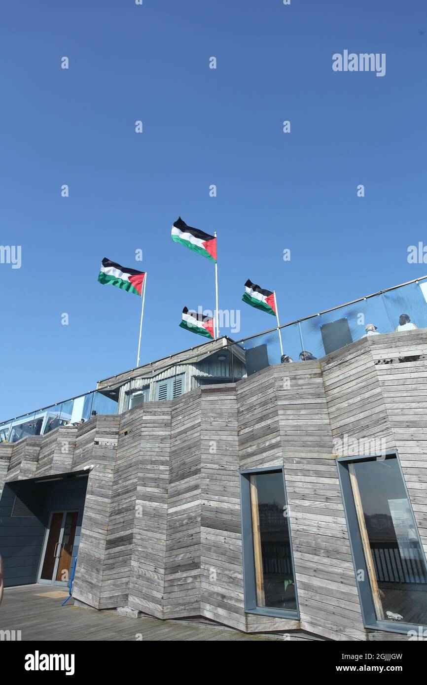 Palestinian flags flying on Hastings pier during 'Palestine on the Pier ...