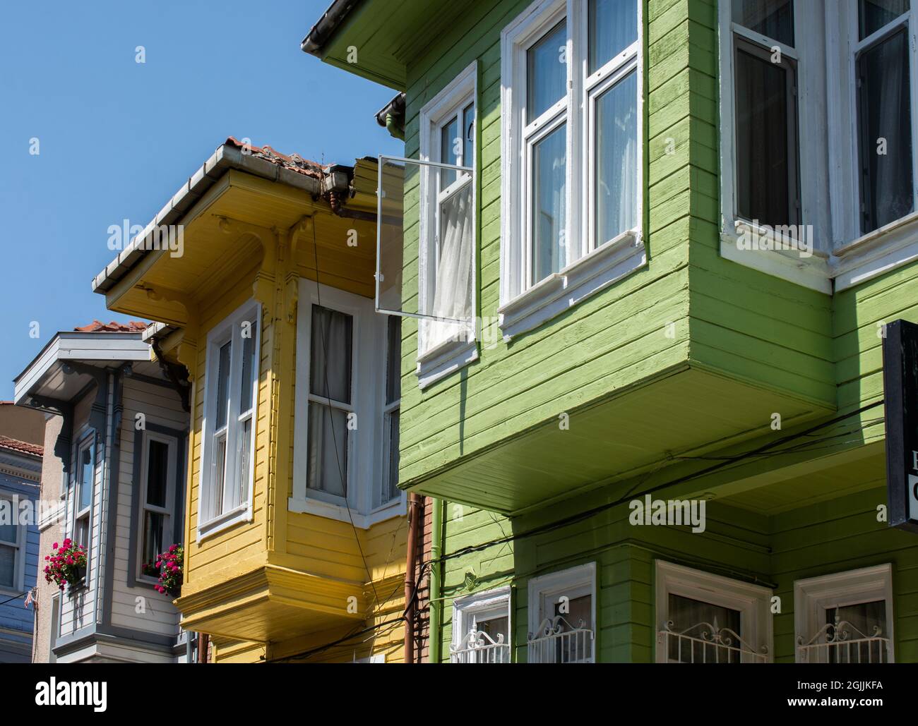 Differently colored houses with windows next to each other Stock Photo ...