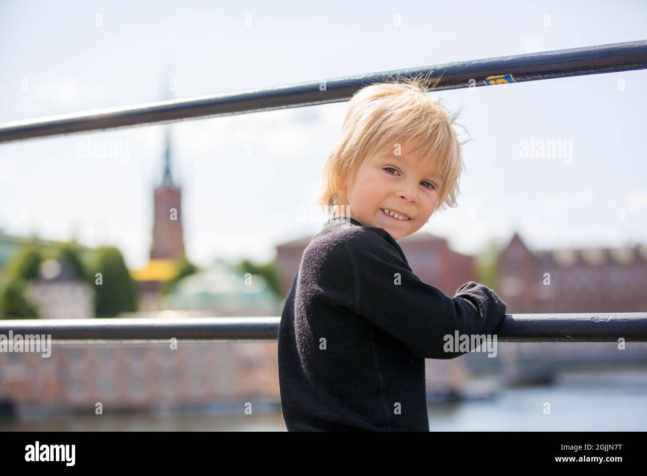 Young preschool child, visiting city of Stockholm with his family ...