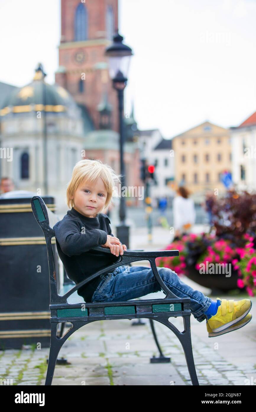 Young preschool child, visiting city of Stockholm with his family ...
