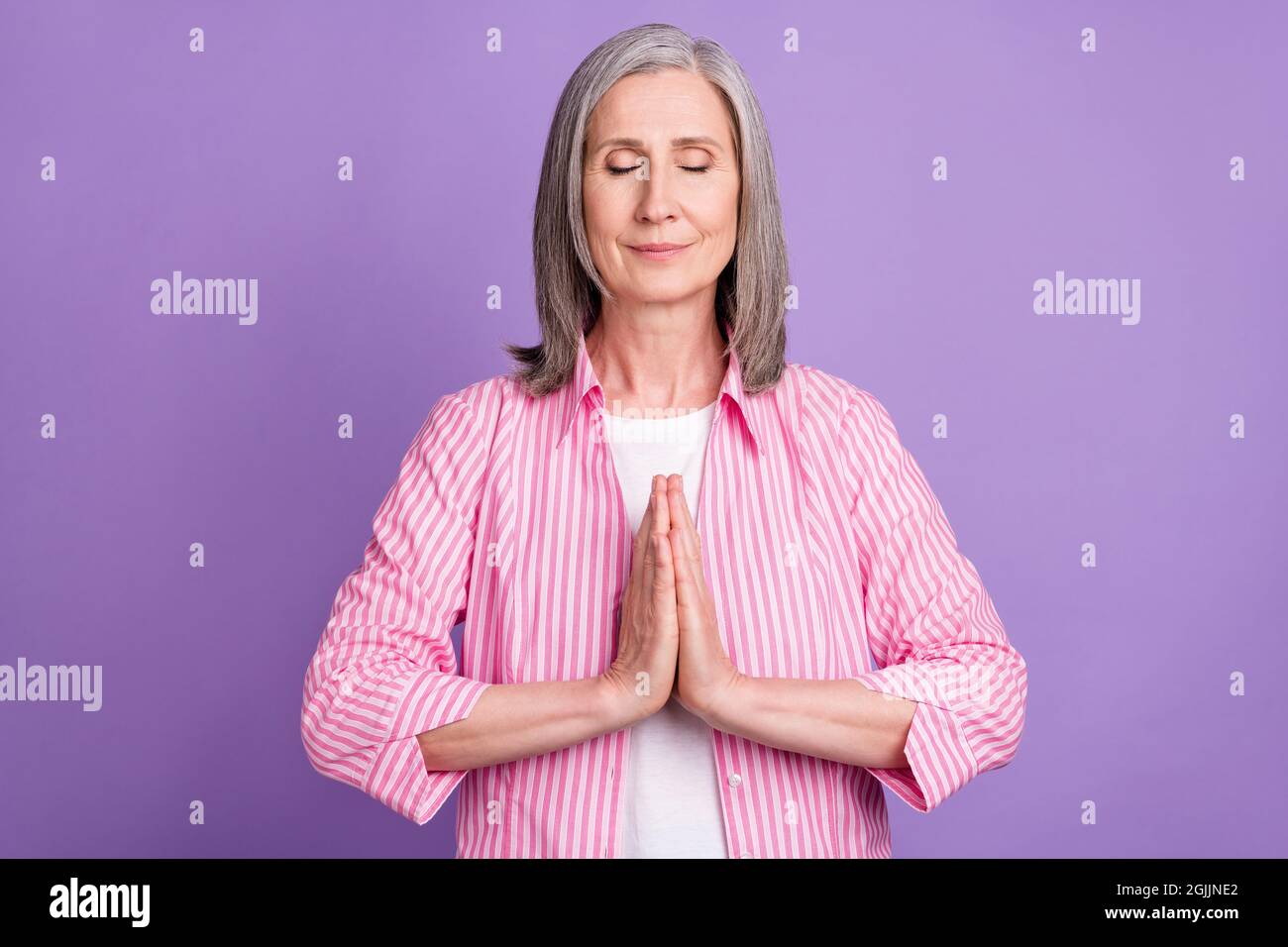 Photo of aged woman happy positive smile pray beg dream wish hope ...