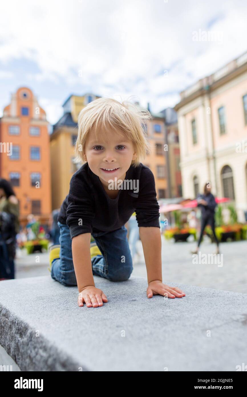 Young preschool child, visiting city of Stockholm with his family ...