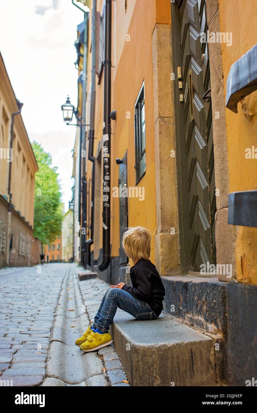 Young preschool child, visiting city of Stockholm with his family ...