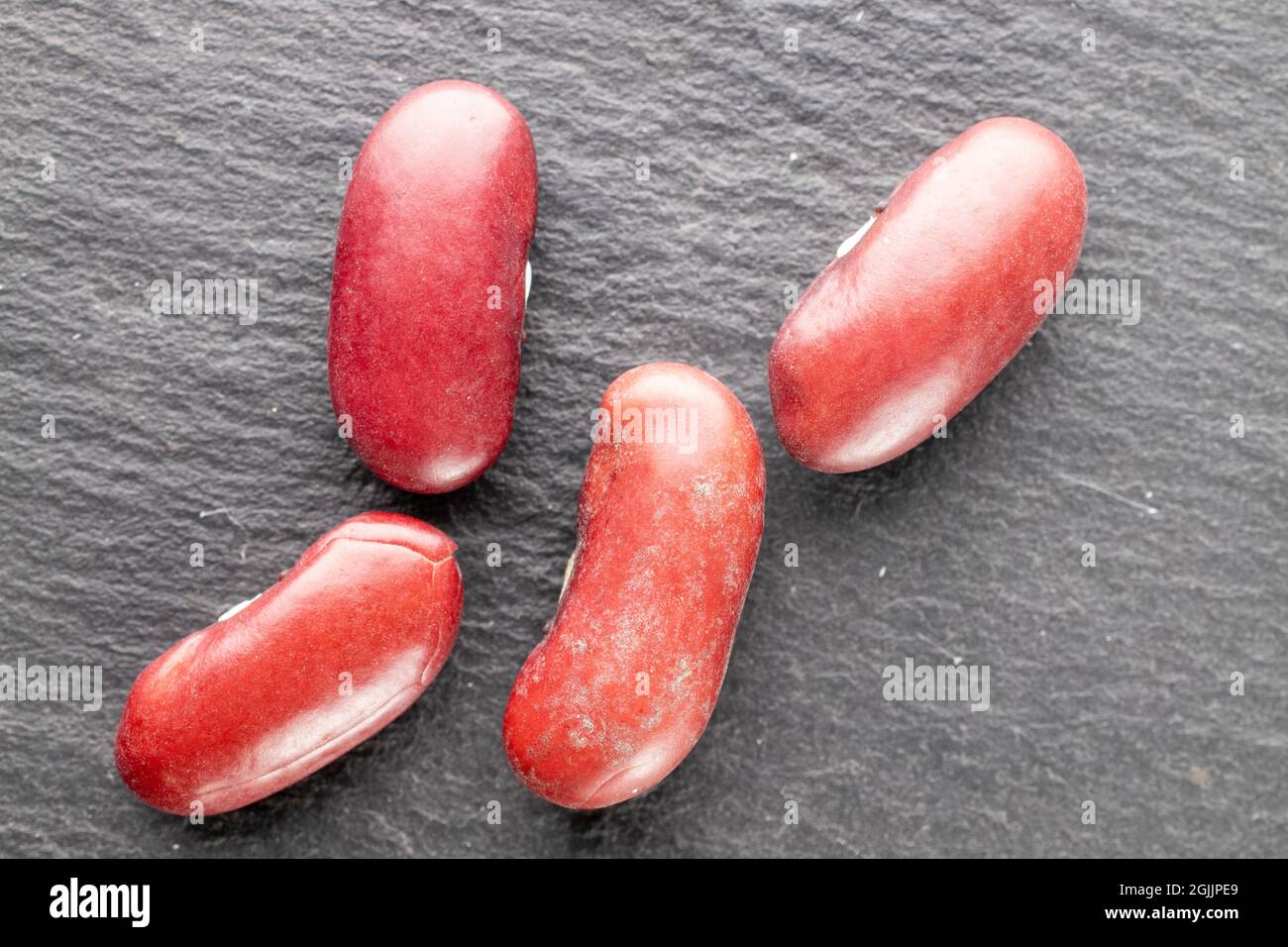 Raw red beans on a slate board, close-up, top view Stock Photo - Alamy