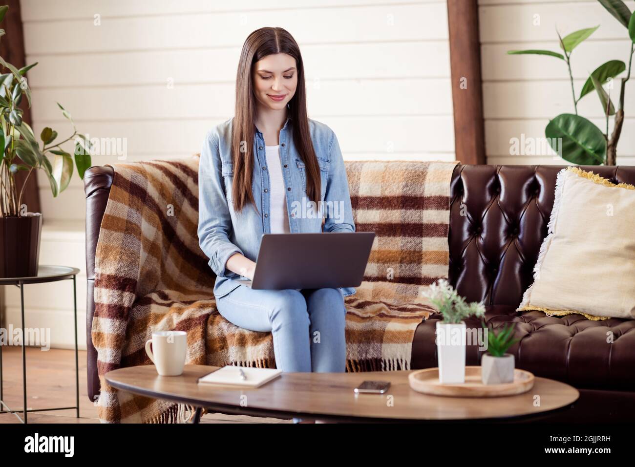 Photo of young business woman happy positive smile sit couch remote ...