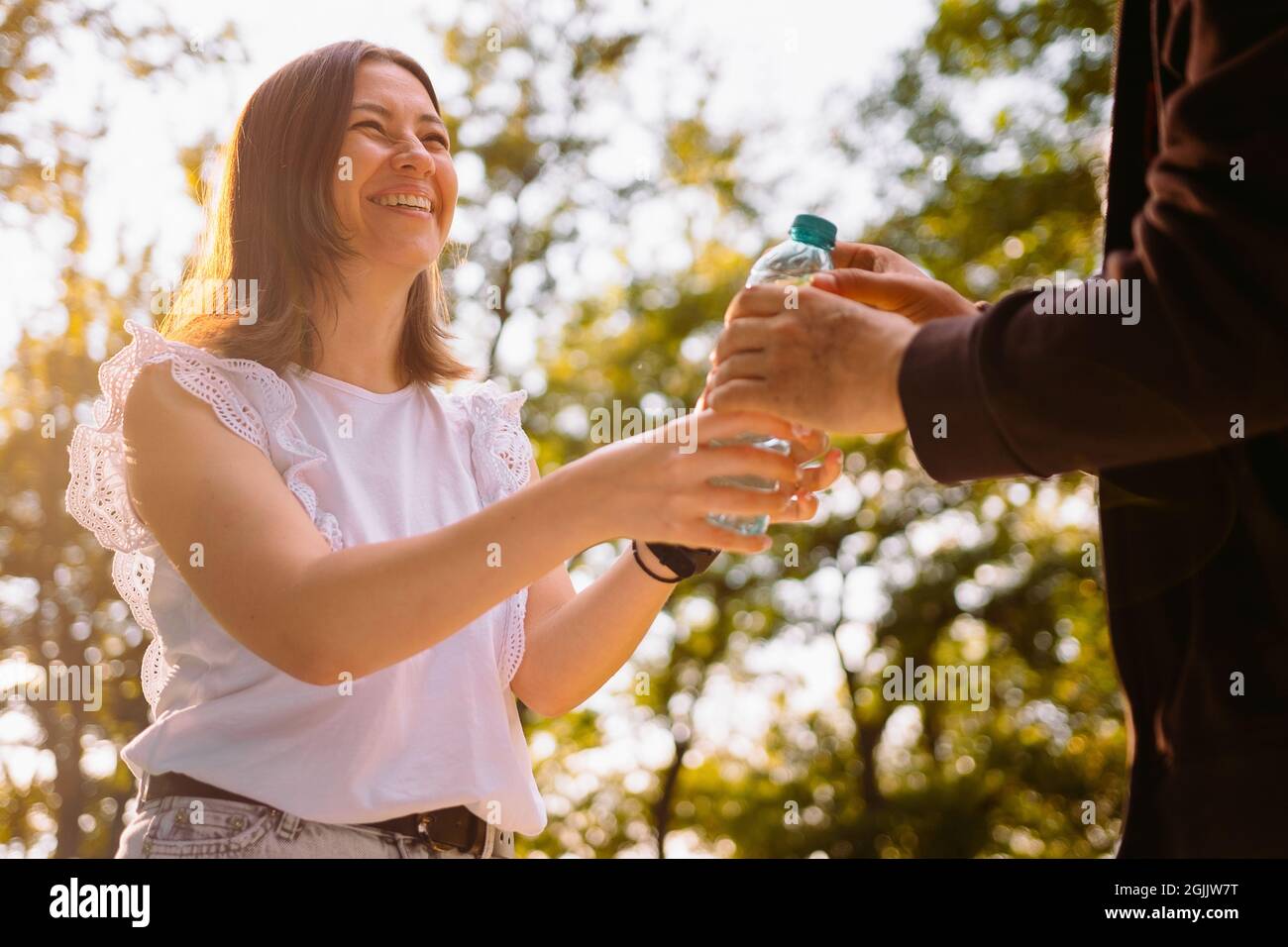 Giving drink homeless hi-res stock photography and images - Alamy