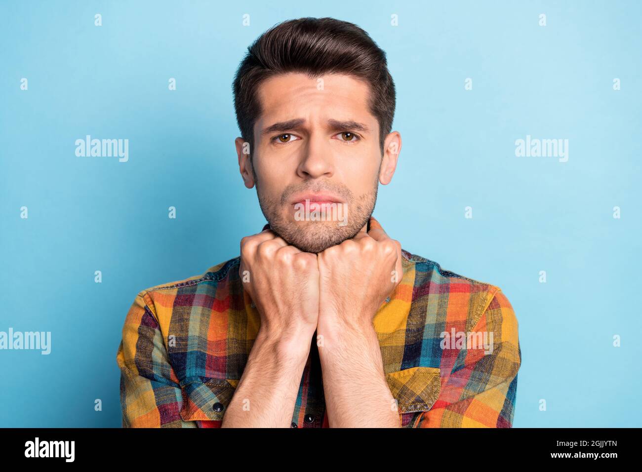 Portrait of attractive discontent confused guy waiting news bad mood ...