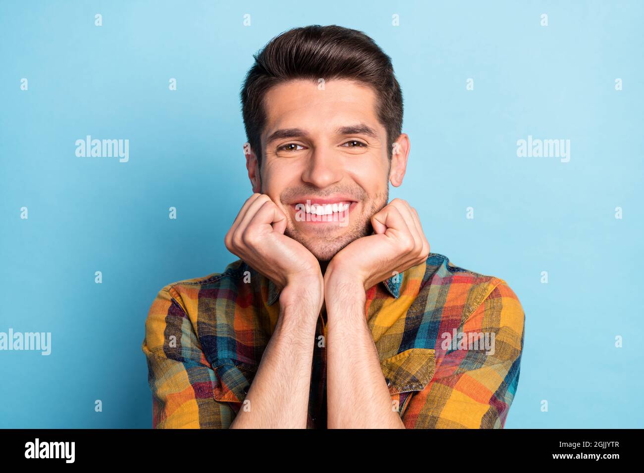 Portrait of attractive cheerful content brunette guy waiting good news ...