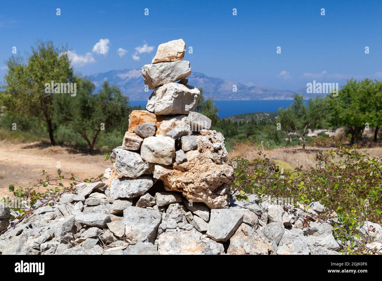 A cairn marking a mountain route, a man-made pile of stones for ...