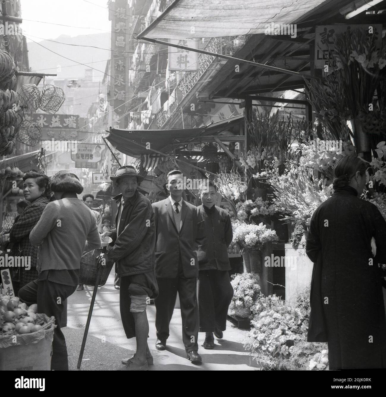 1950s, historical, local chinese people in one of the small narrow ...