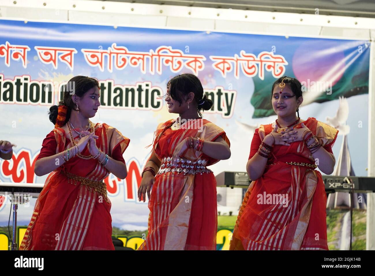 Young girls dancing on stage wearing red sari dress Stock Photo - Alamy