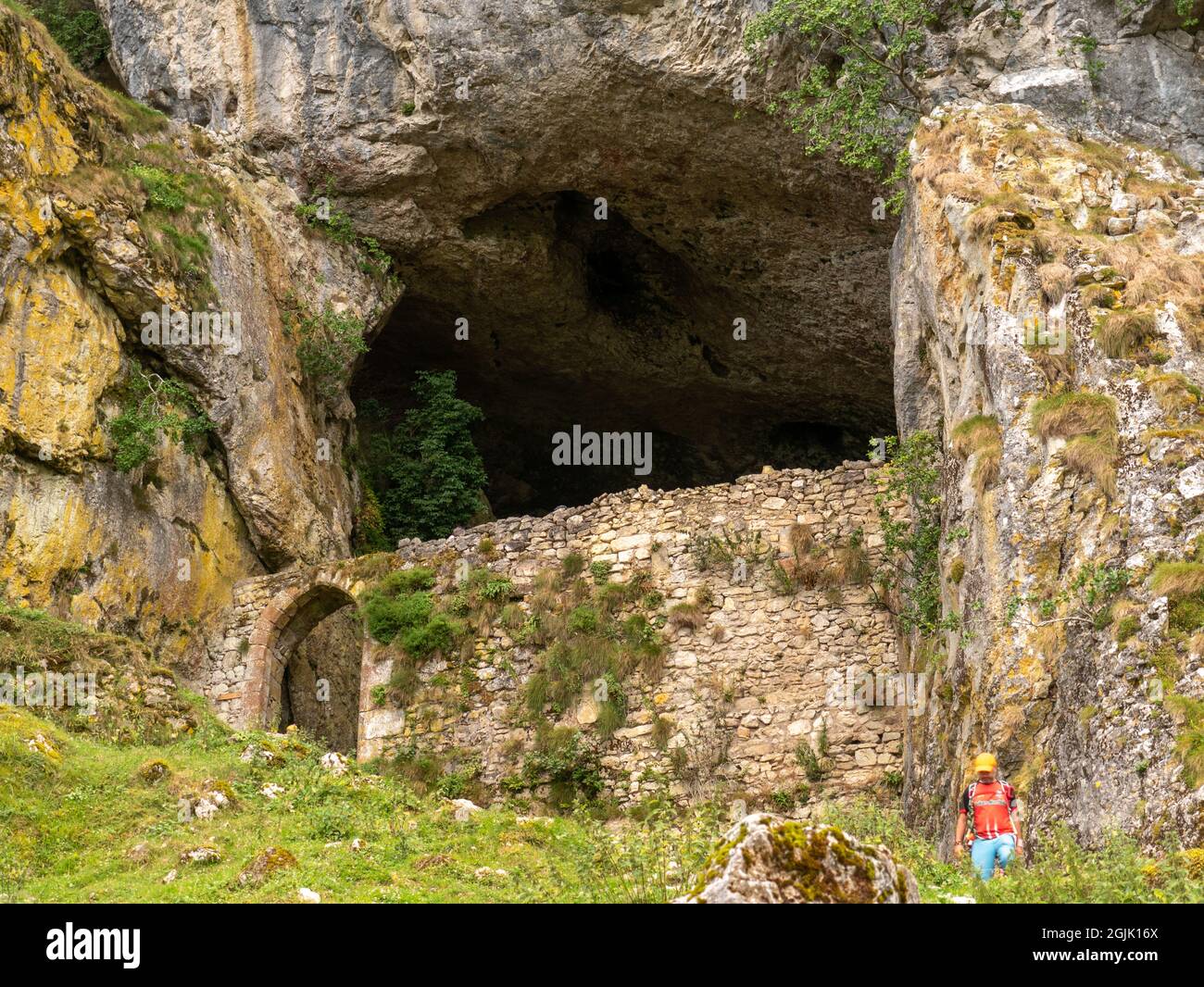 The San Adrian cave opening on a massive rock at the Aizkorri mountain ...