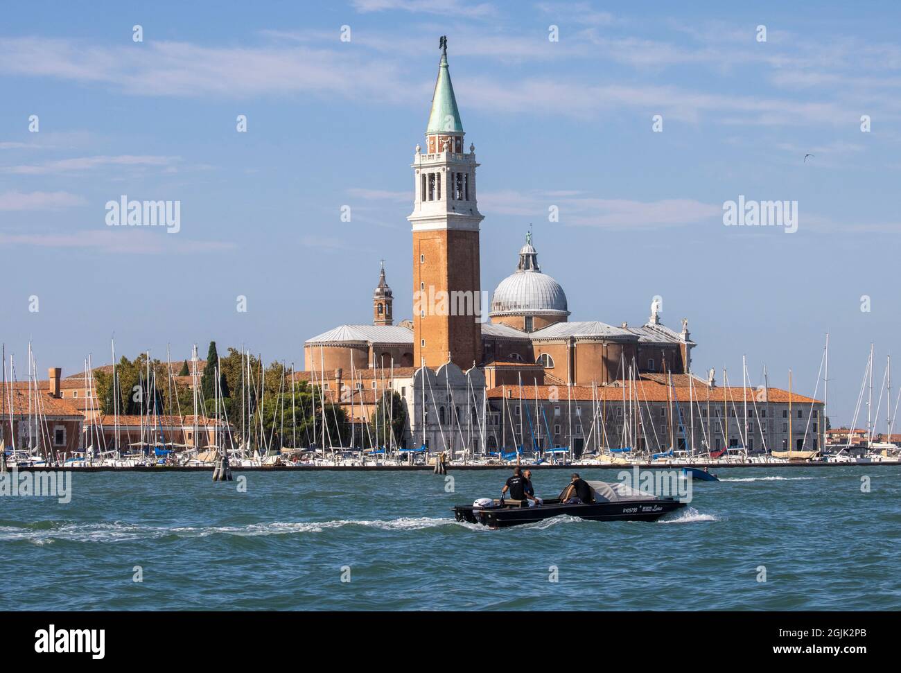 A boat passes the island of San Giorgio Maggiore which is opposite the ...